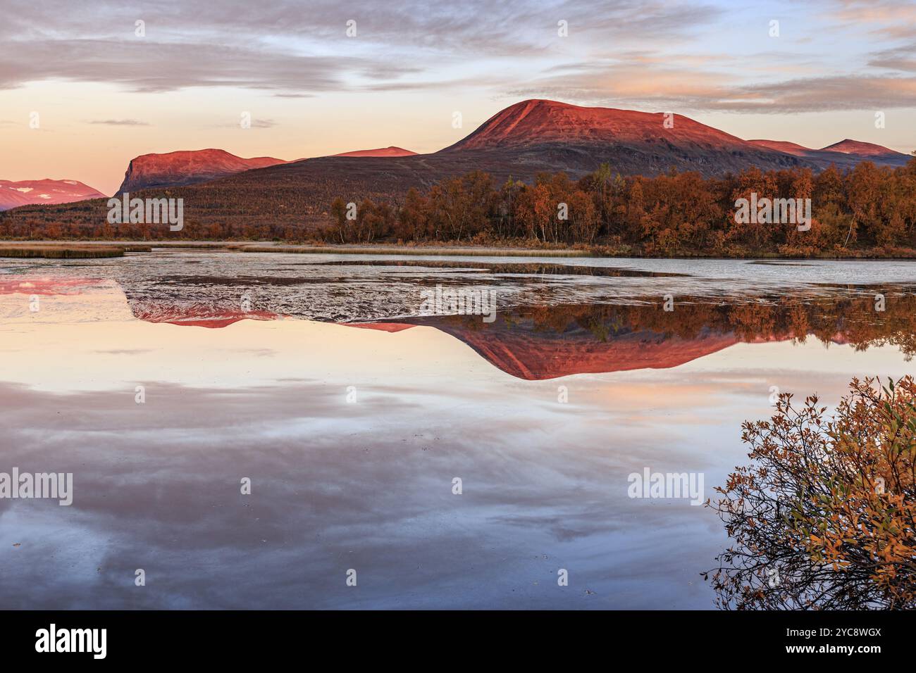 Mountains reflected in lake, autumn colours, cloudy mood, morning light ...