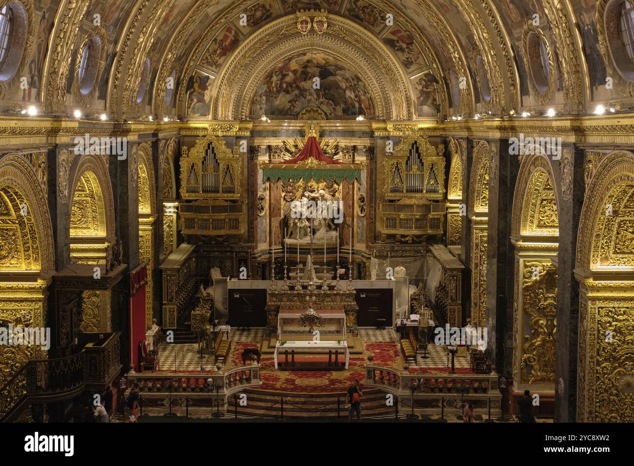 The ornate nave and main altar of St. John Co-Cathedral, Valletta ...