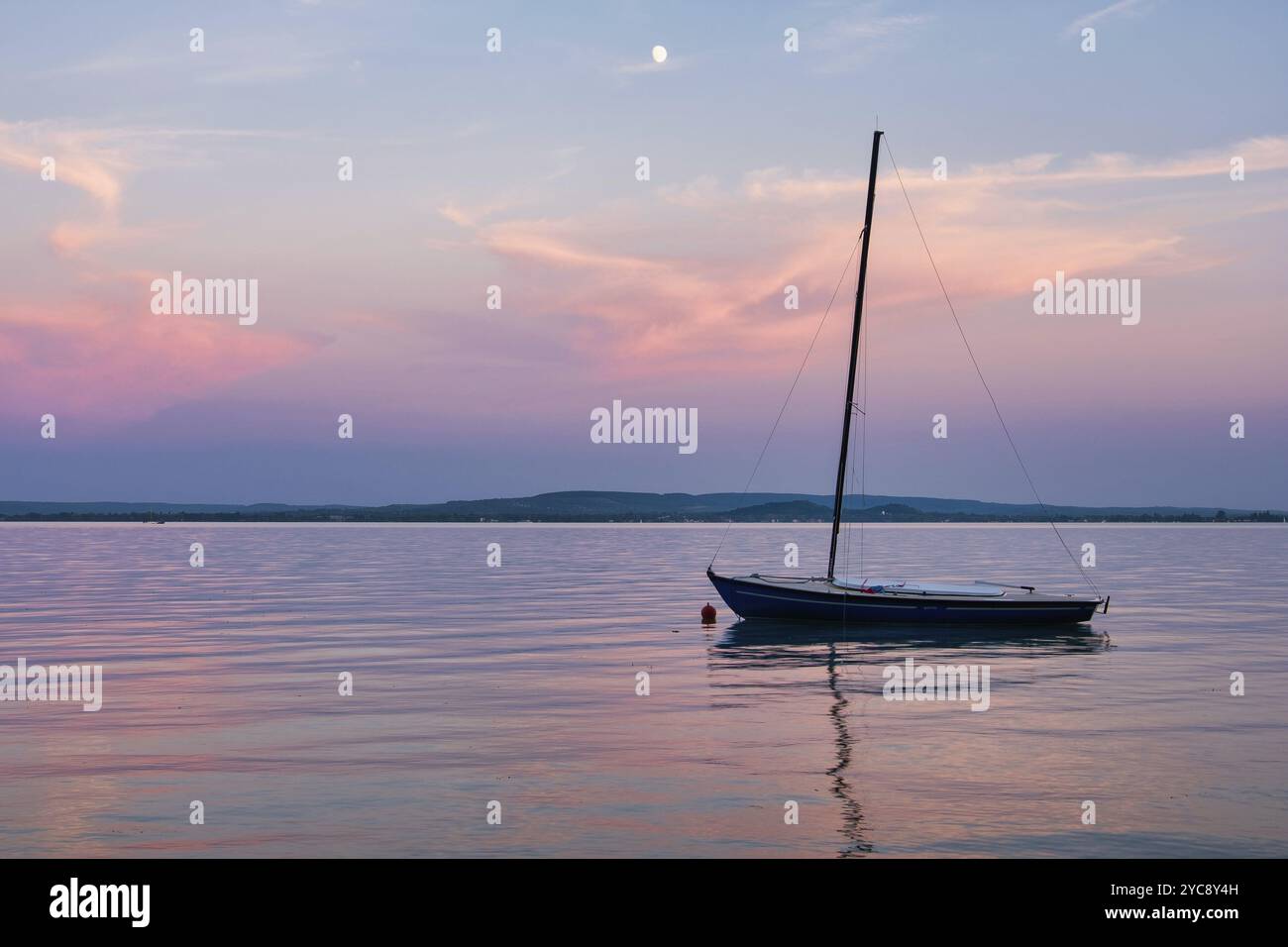 Small sailing boat moored under the moon on Lake Balaton, Revfulop ...