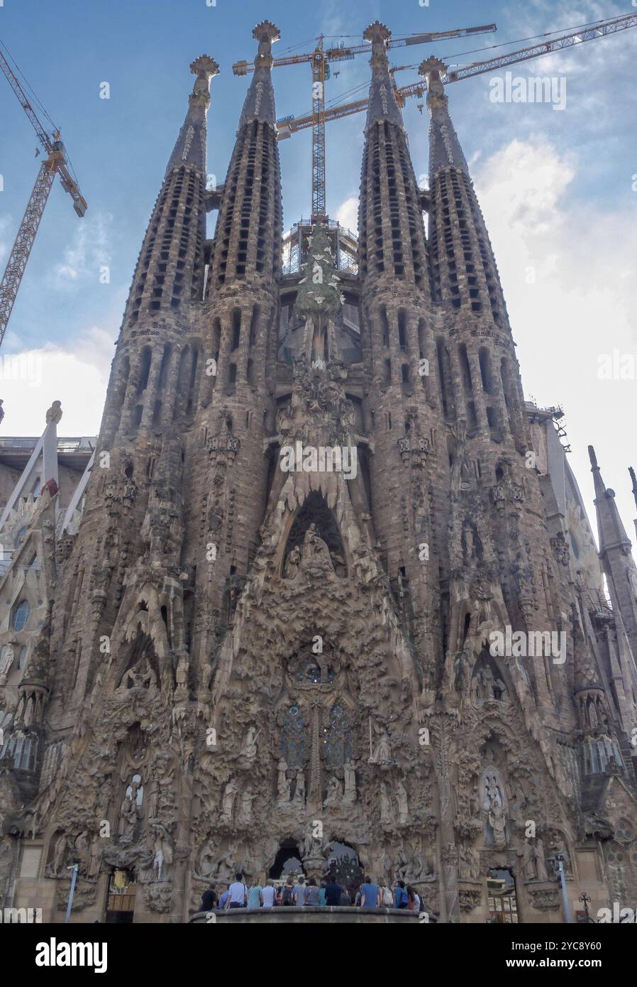 The Nativity facade of the La Sagrada Familia and three tower cranes ...