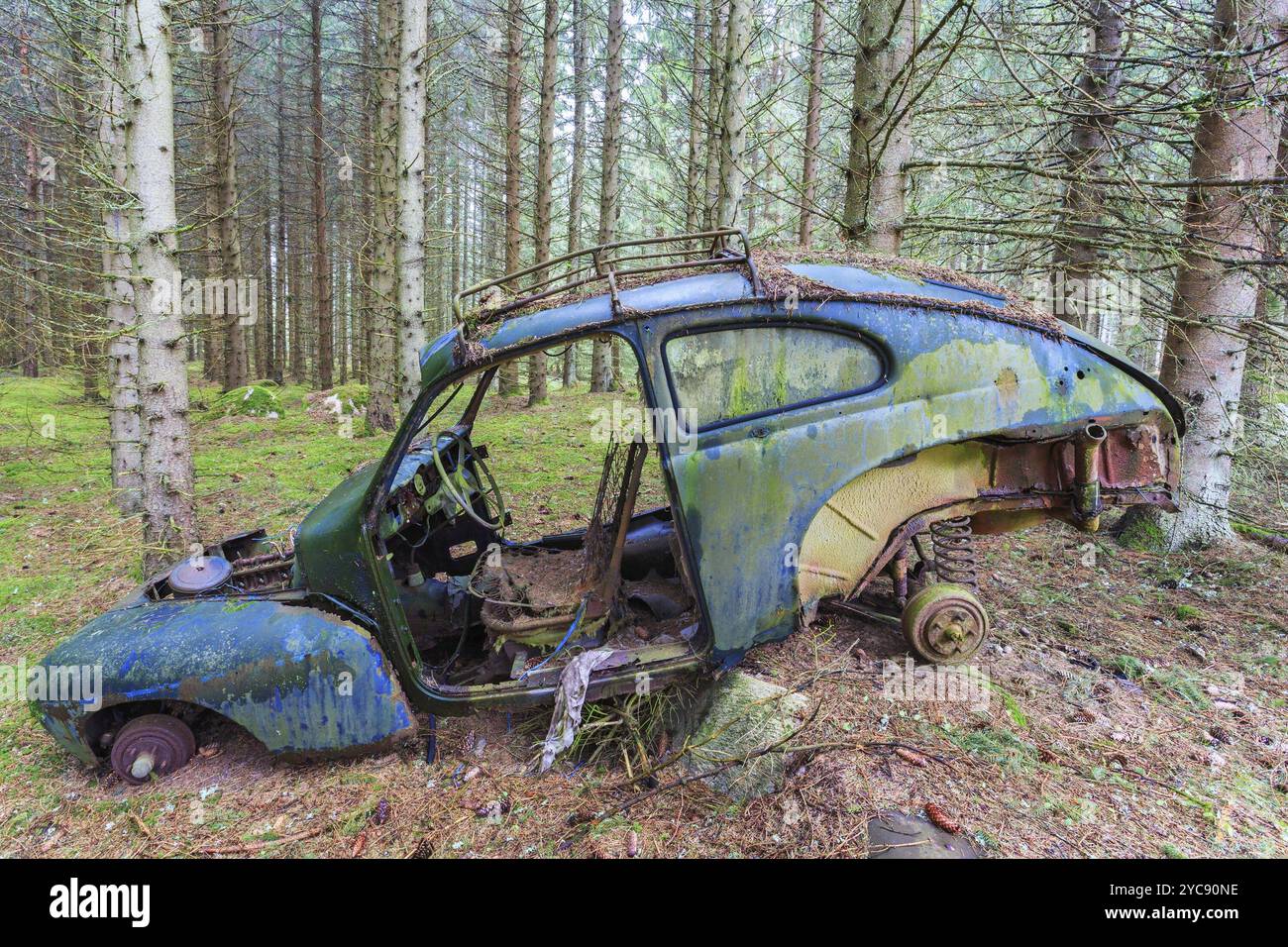 Old wrecked covered car hi-res stock photography and images - Alamy