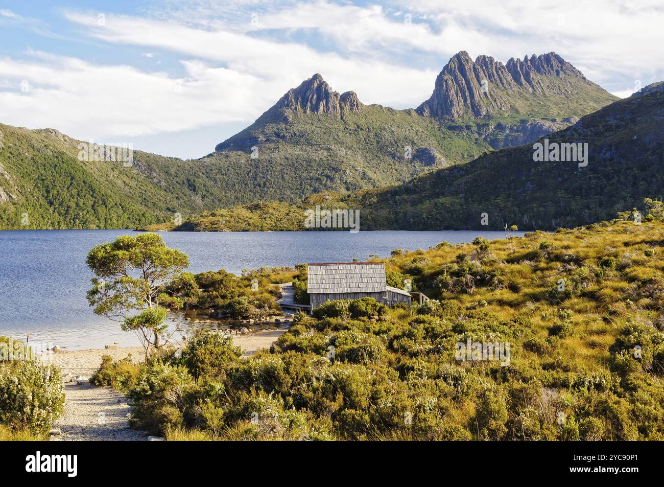 Historic Dove Lake boatshed beneath the towering spires of Cradle ...