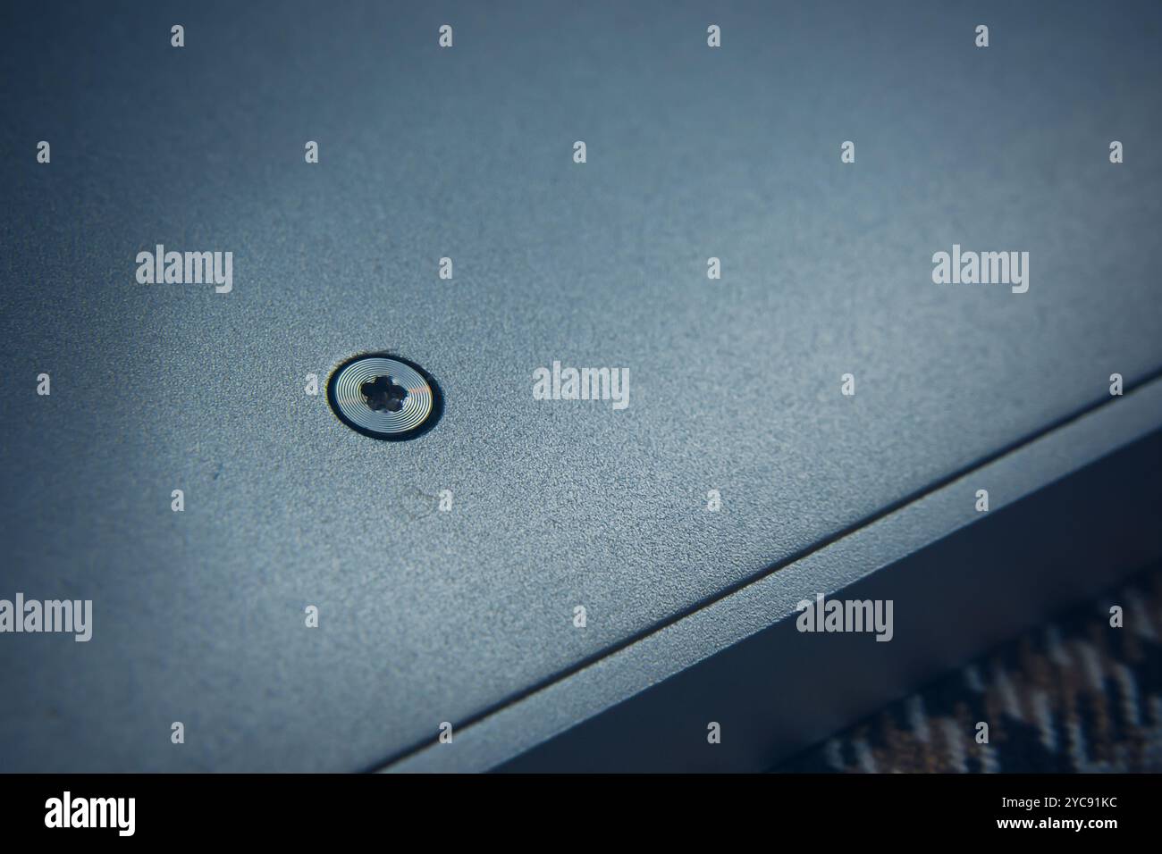 Closeup of a screw fixed on a matte surface, showcasing its design and ...
