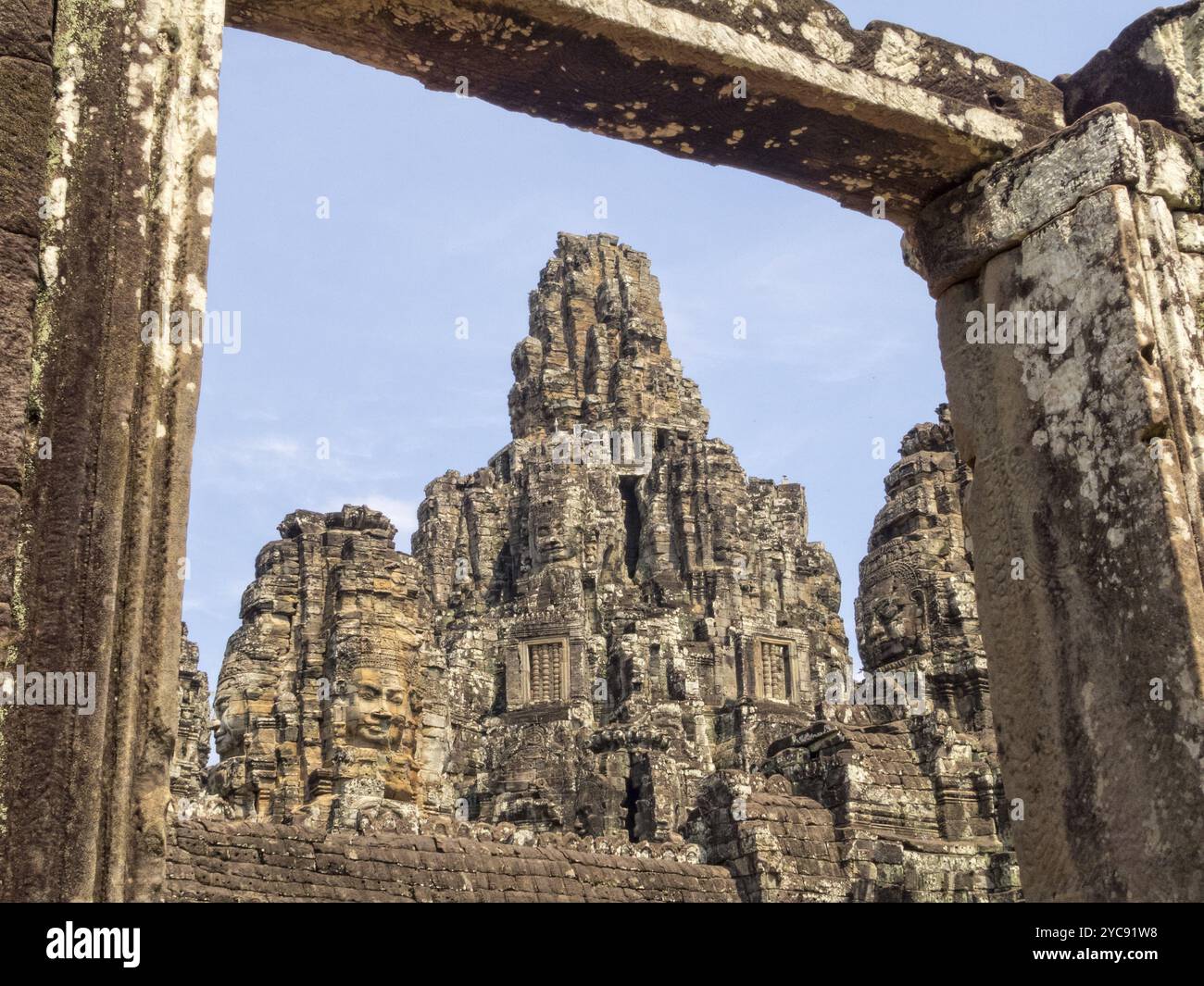 Face towers in a window frame at Angkor Thom, Siem Reap, Cambodia, Asia ...