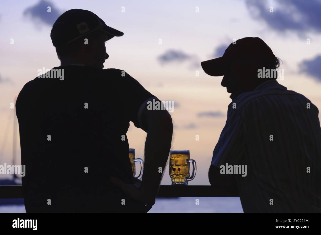 Two blokes enjoy a nice cold beer after a long day's hard work, Port ...