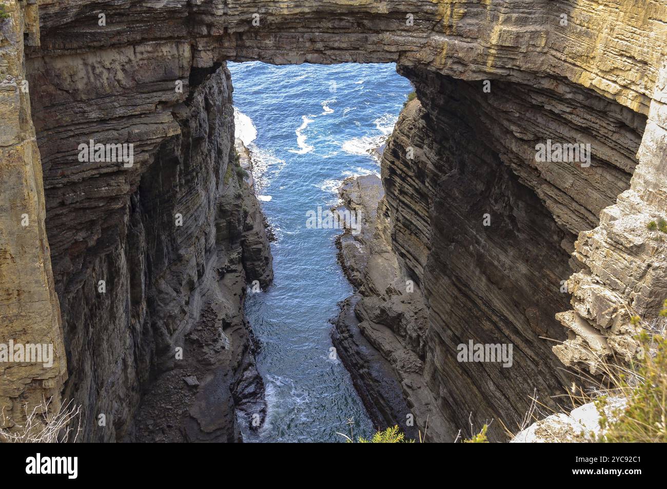 Tasman Arch has been created by the wind and waves for millions of ...