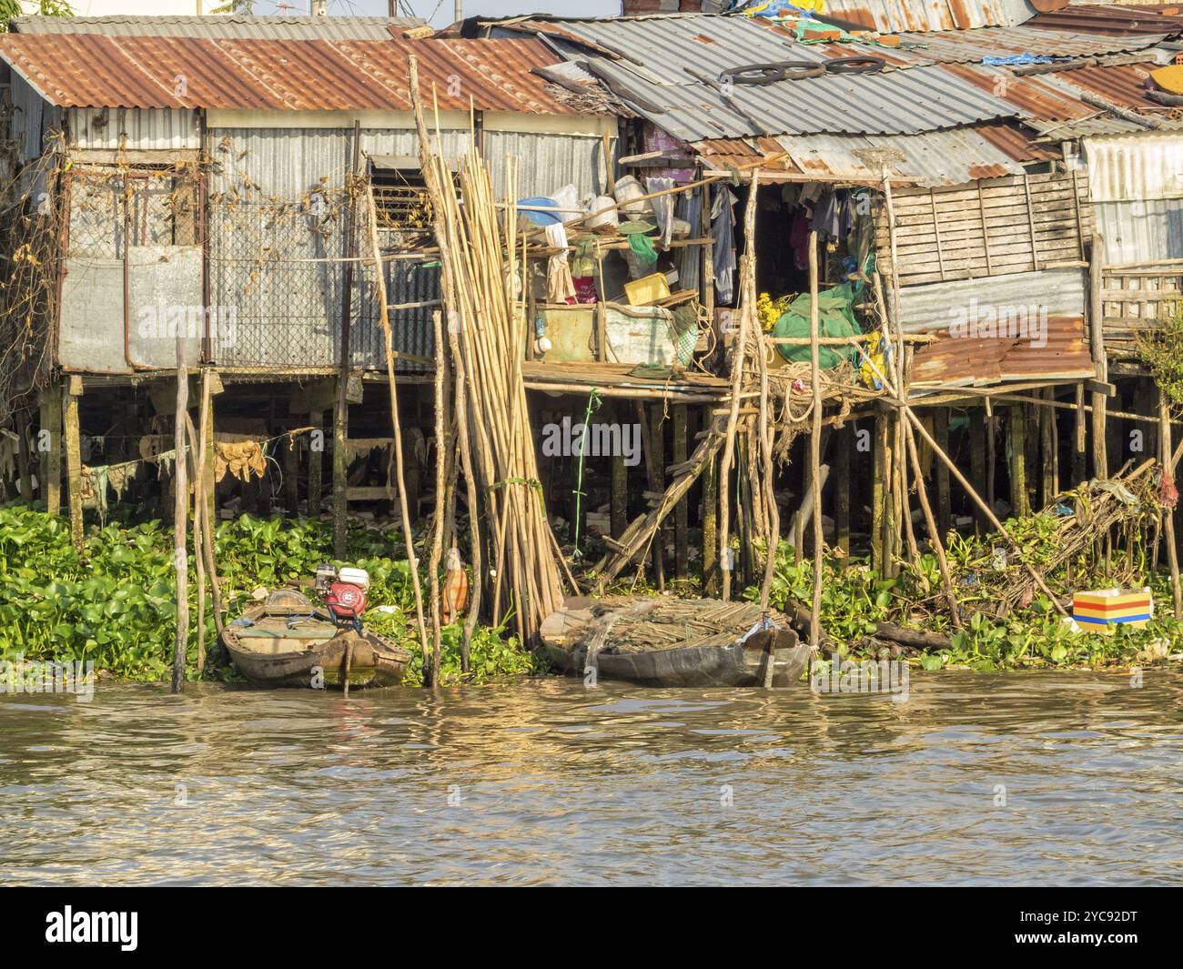 Shacks on stilts alog the Hau River in the Mekong Delta, Can Tho ...