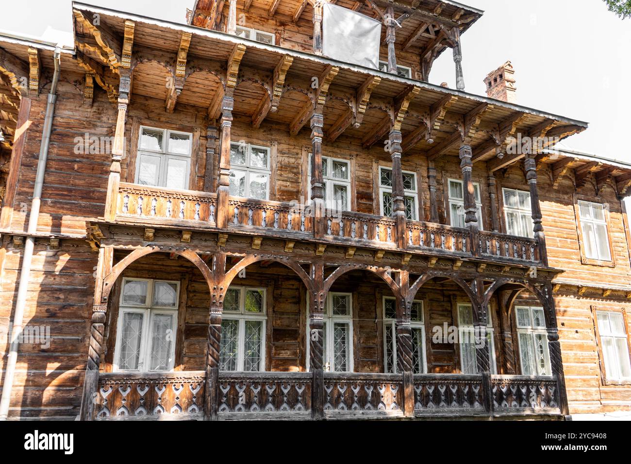Wooden house timber. Windows and balcony of an old building ...