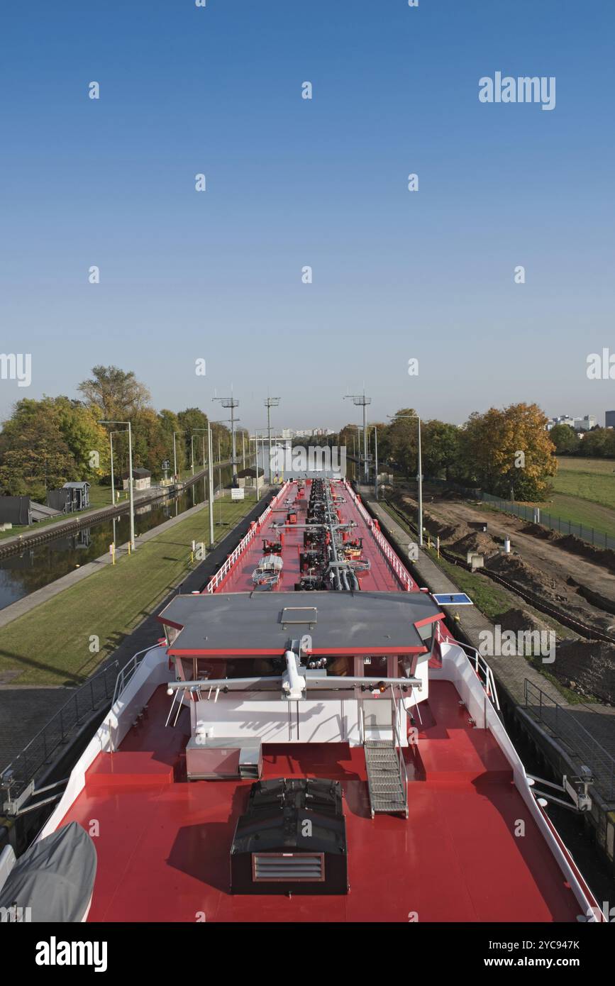 A tanker vessel leaves the lock in Frankfurt-Griesheim, Germany, Europe ...