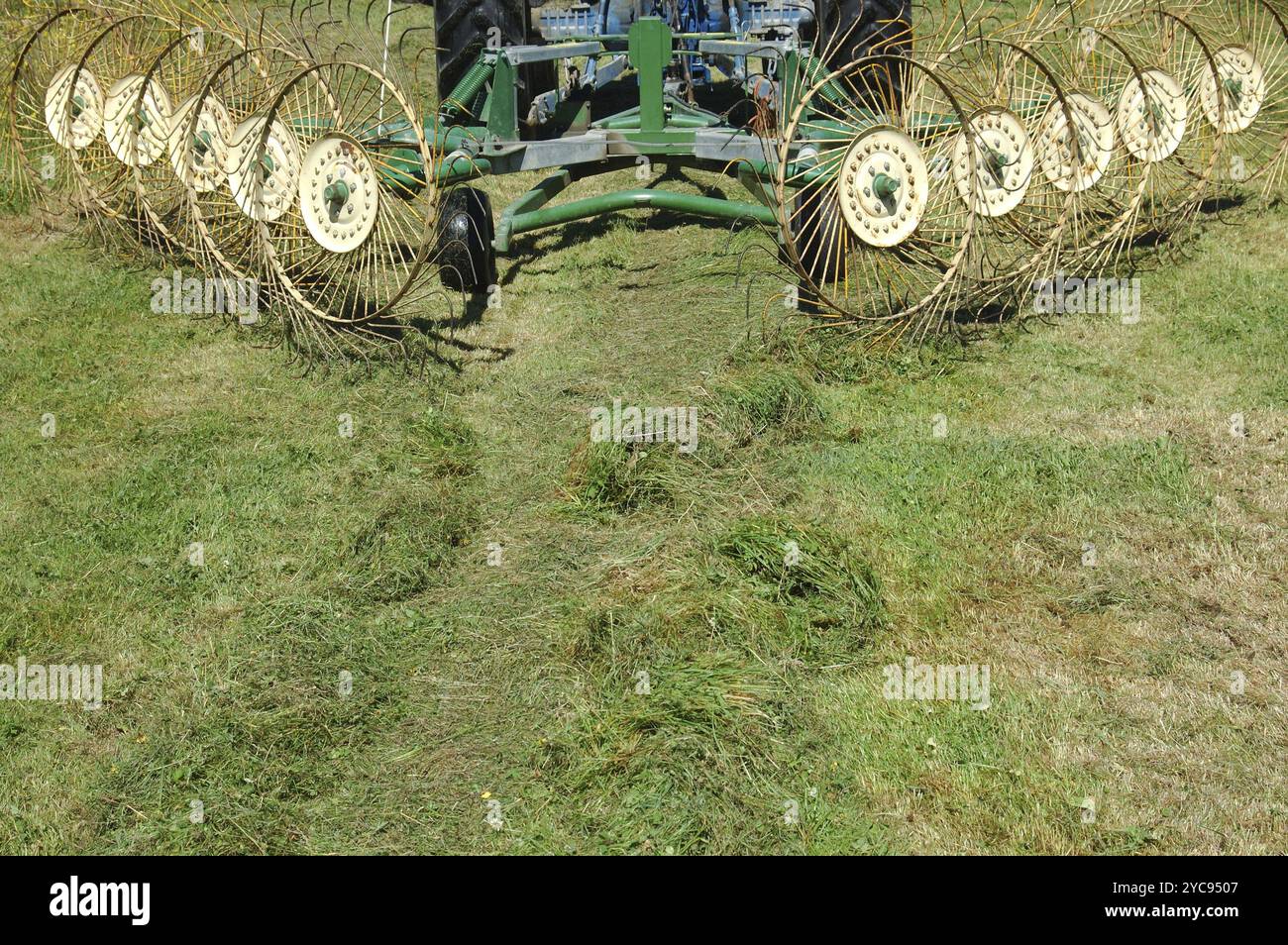 Tractor raking field hi-res stock photography and images - Alamy