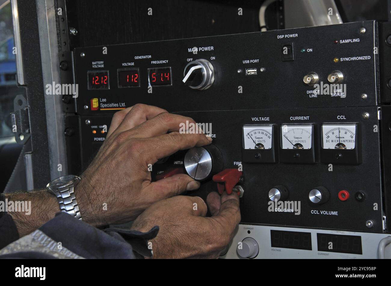 Drilling crewman fires the explosive charges that perforate the oil ...
