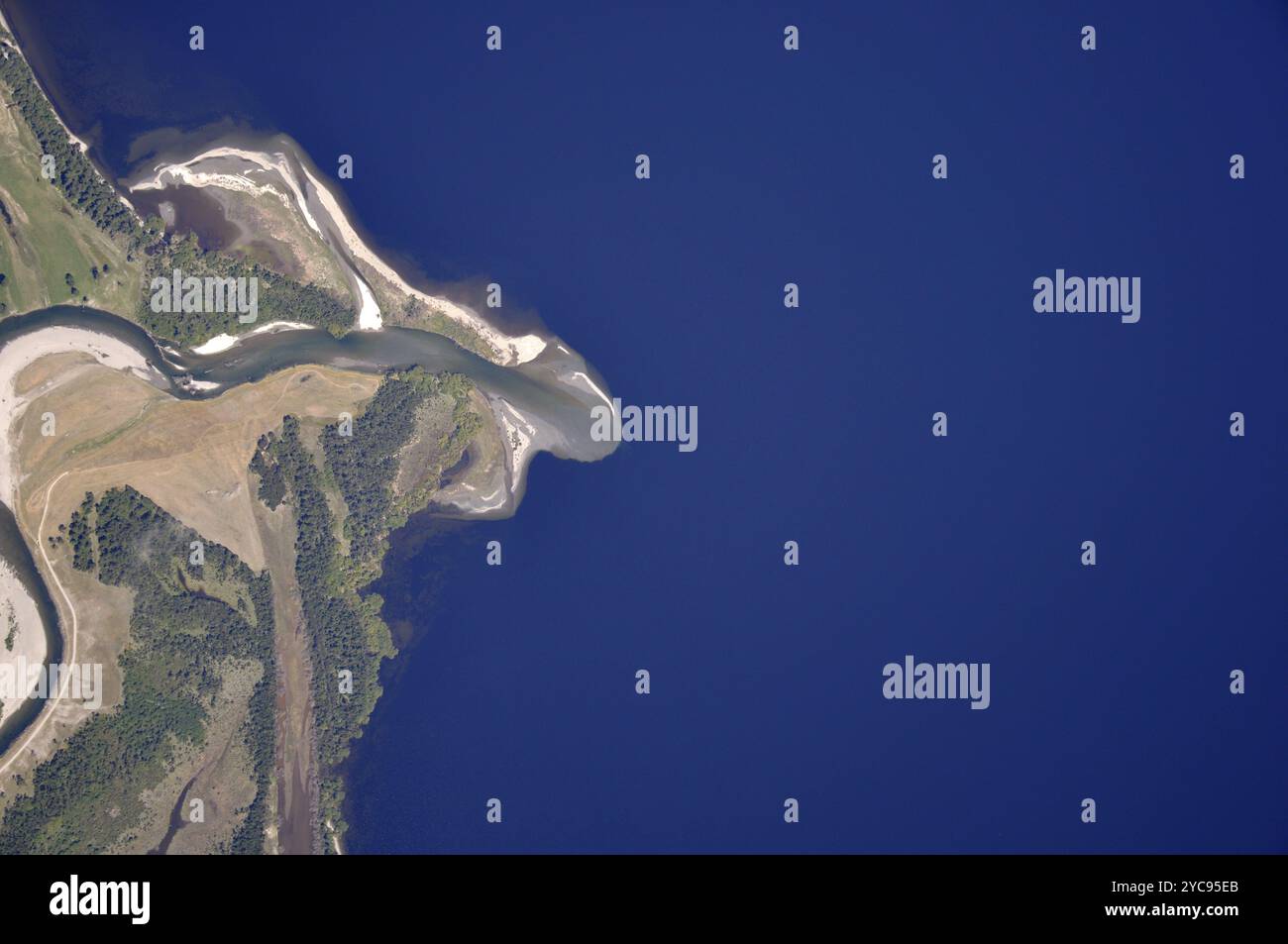Aerial of creek flowing into Lake Brunner, West Coast, South Island ...