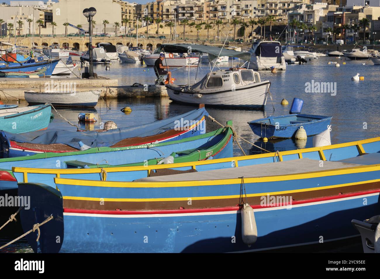 Colourful mooring fishing boats in the harbour, Marsaskala, Malta ...