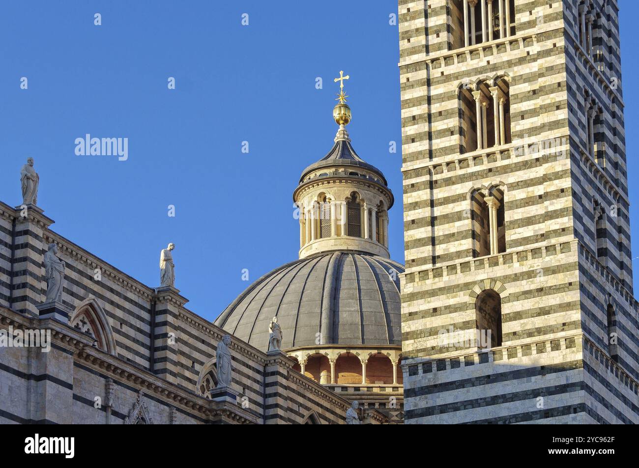 Dome and Bell Tower of the Cathedral (Duomo) of Siena lit by the ...