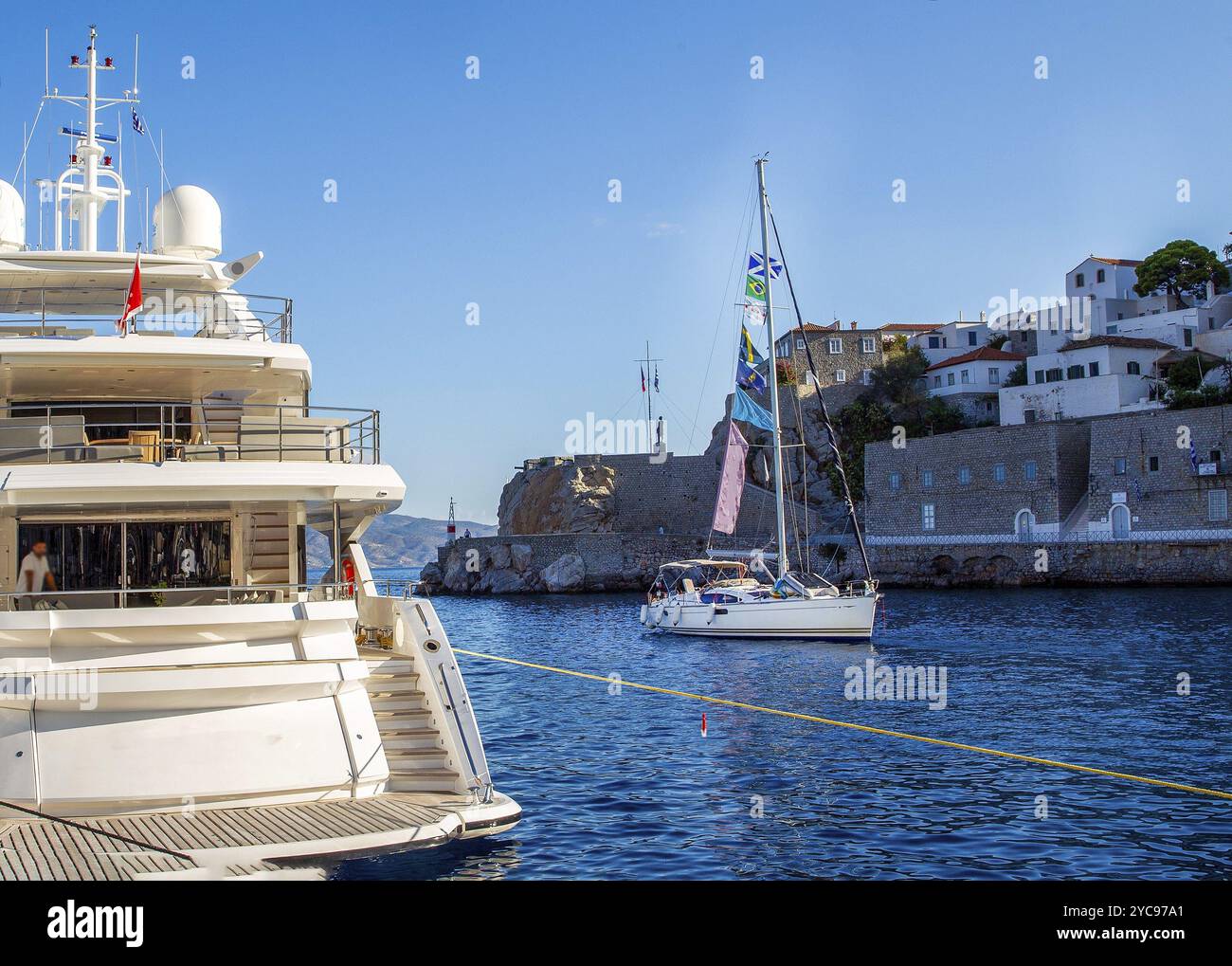 Yacht moving on diesel fuel in harbor Hydra. Amazing morning at Greek ...