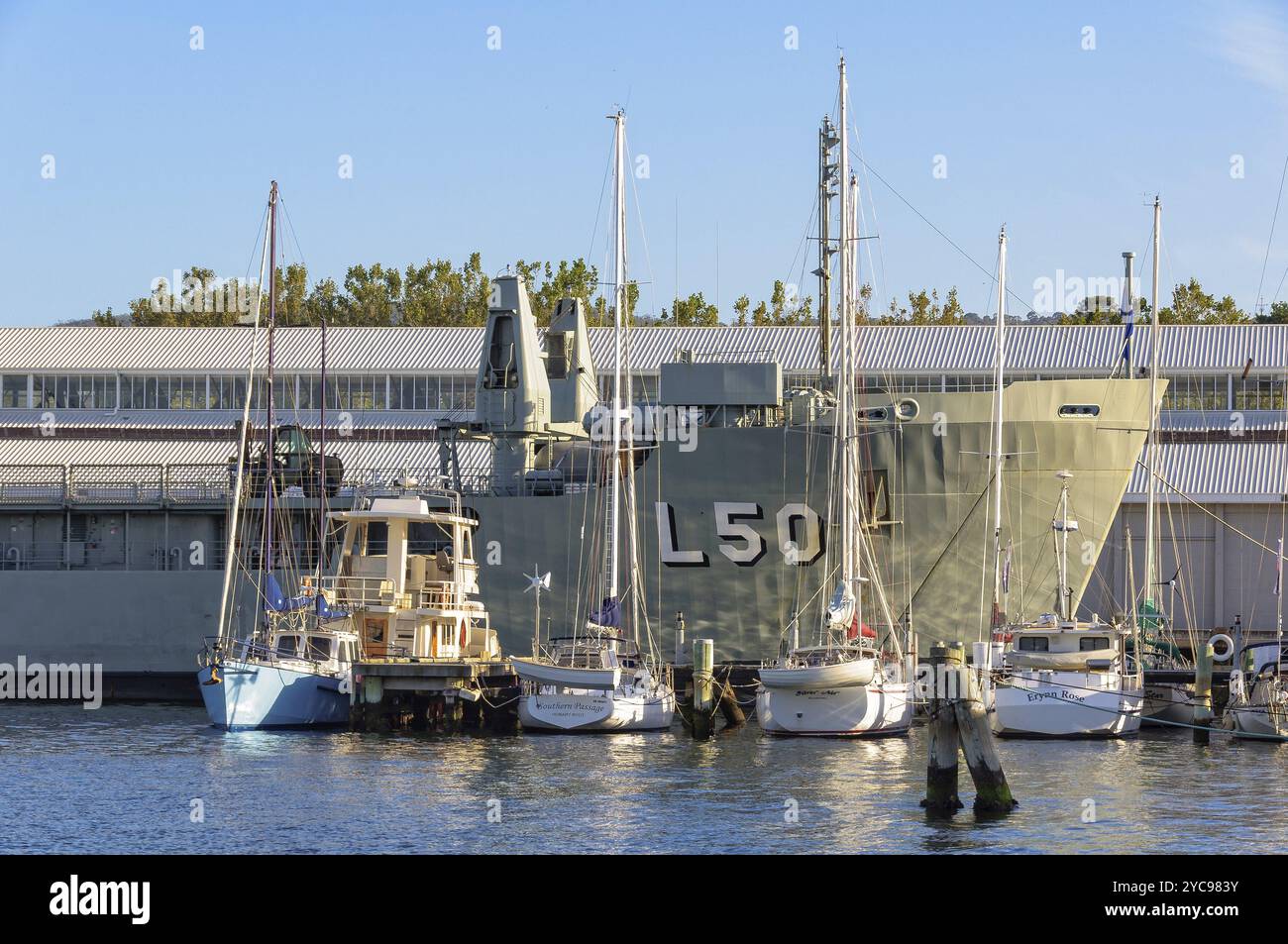 Boats and a warship on anchor in the Murrat St Pier of Hobart, Tasmania ...