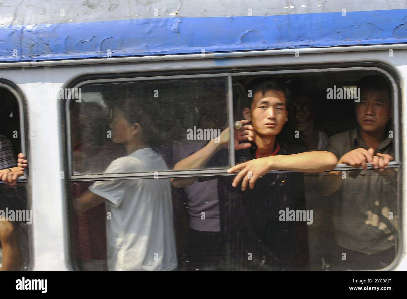 09.08.2012, Pyongyang, North Korea, Asia, Passengers in a crowded tram ...