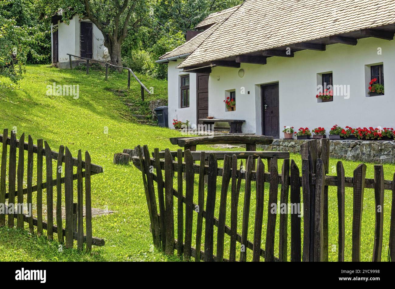 The fence and backyard of a farmhouse in Holloko, Hungary, Europe Stock ...