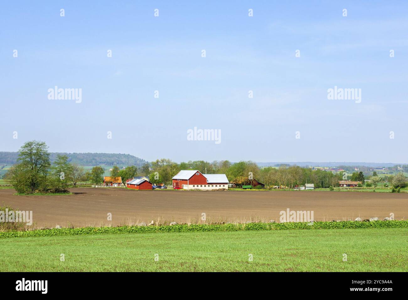 Landscape view with fields and farms in the swedish countryside in ...
