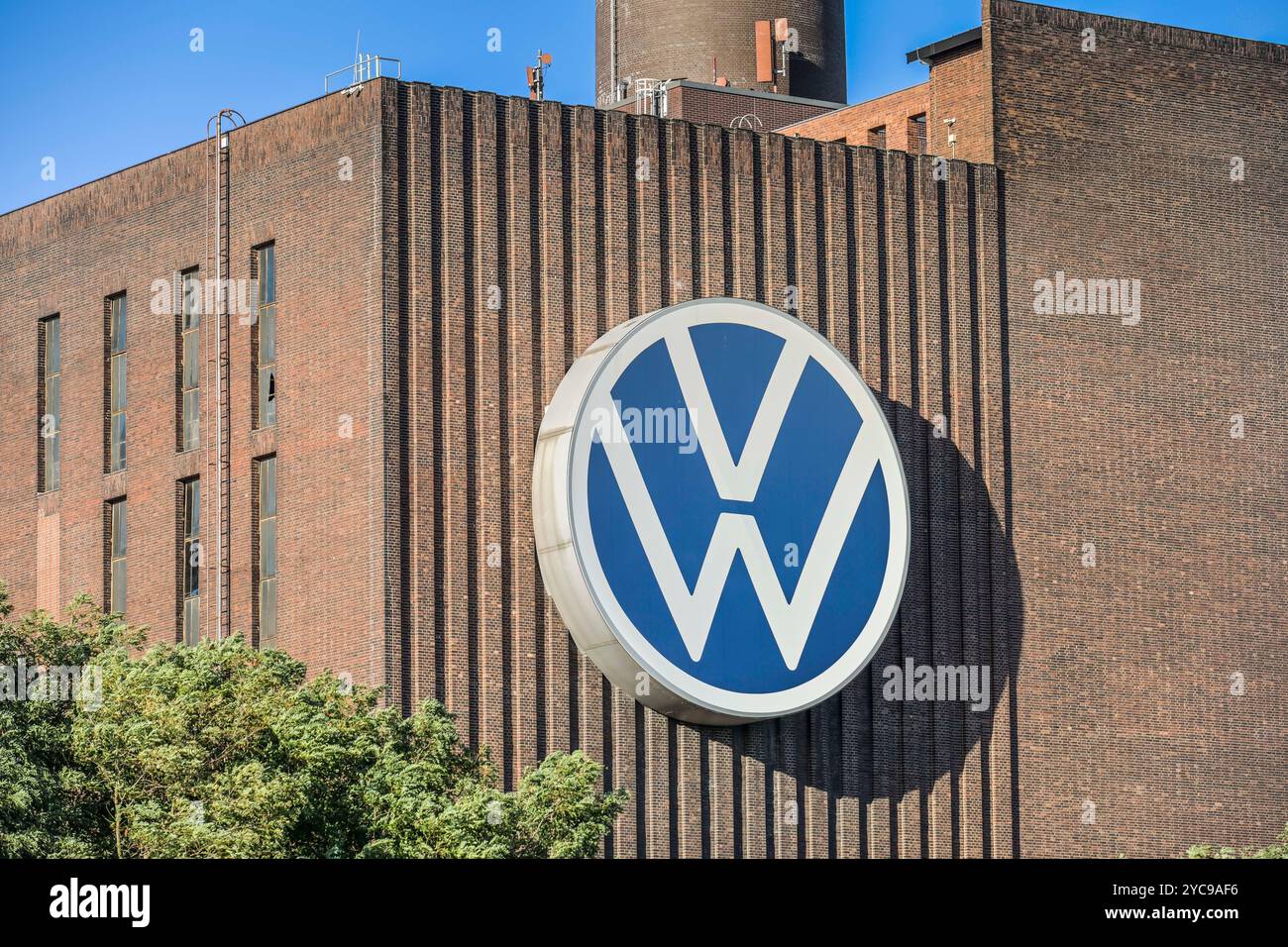 Volkswagen logo at the VW power plant, Wolfsburg plant, Lower Saxony ...