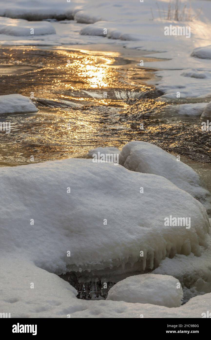 Snow and ice in the river Stock Photo - Alamy