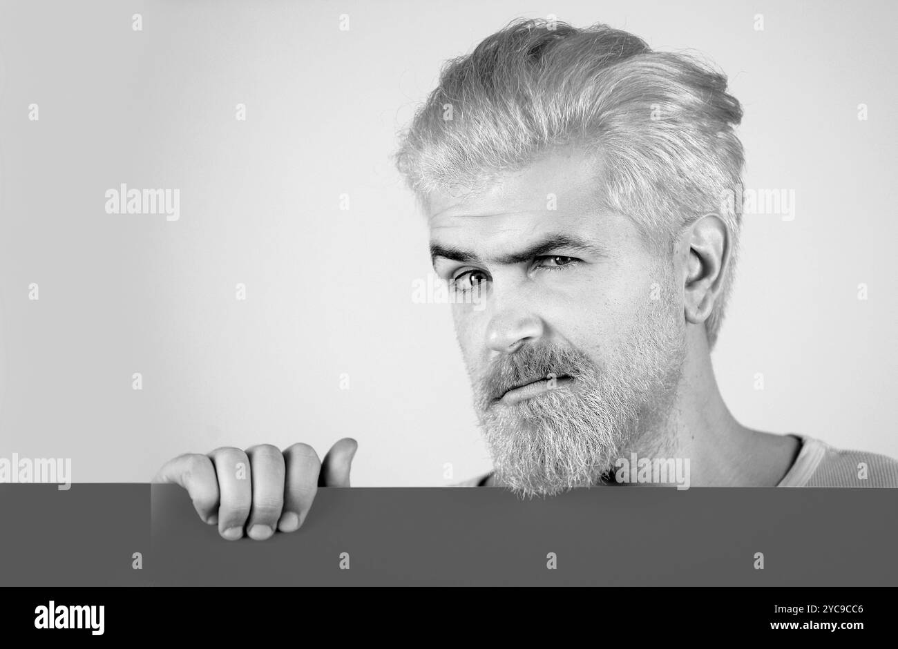 Caucasian blond male model posing in fashion concept studio shoot ...