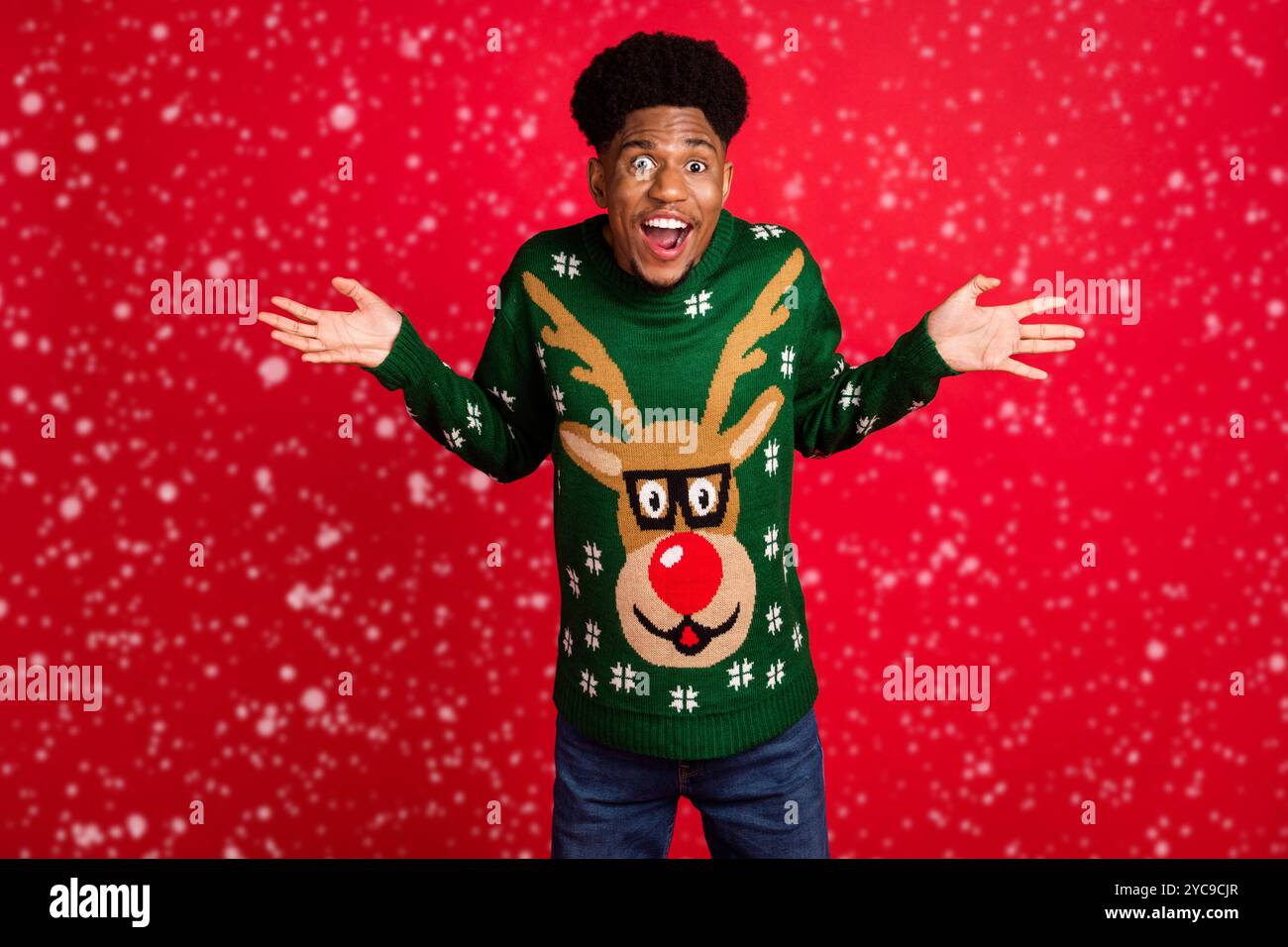Portrait of attractive curious cheerful guy shrugging shoulders newyear ...