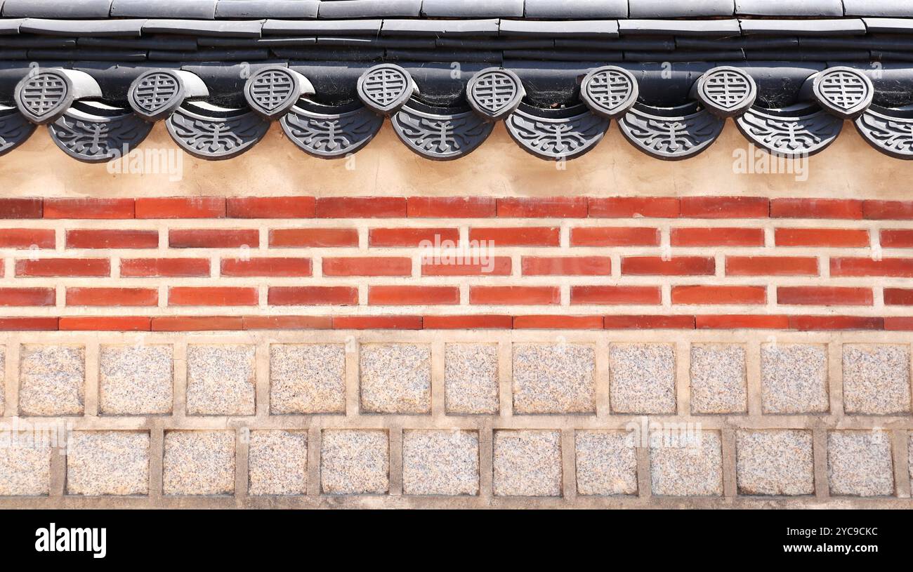 Stucco wall of traditional Korean house with oriental decorative roof ...
