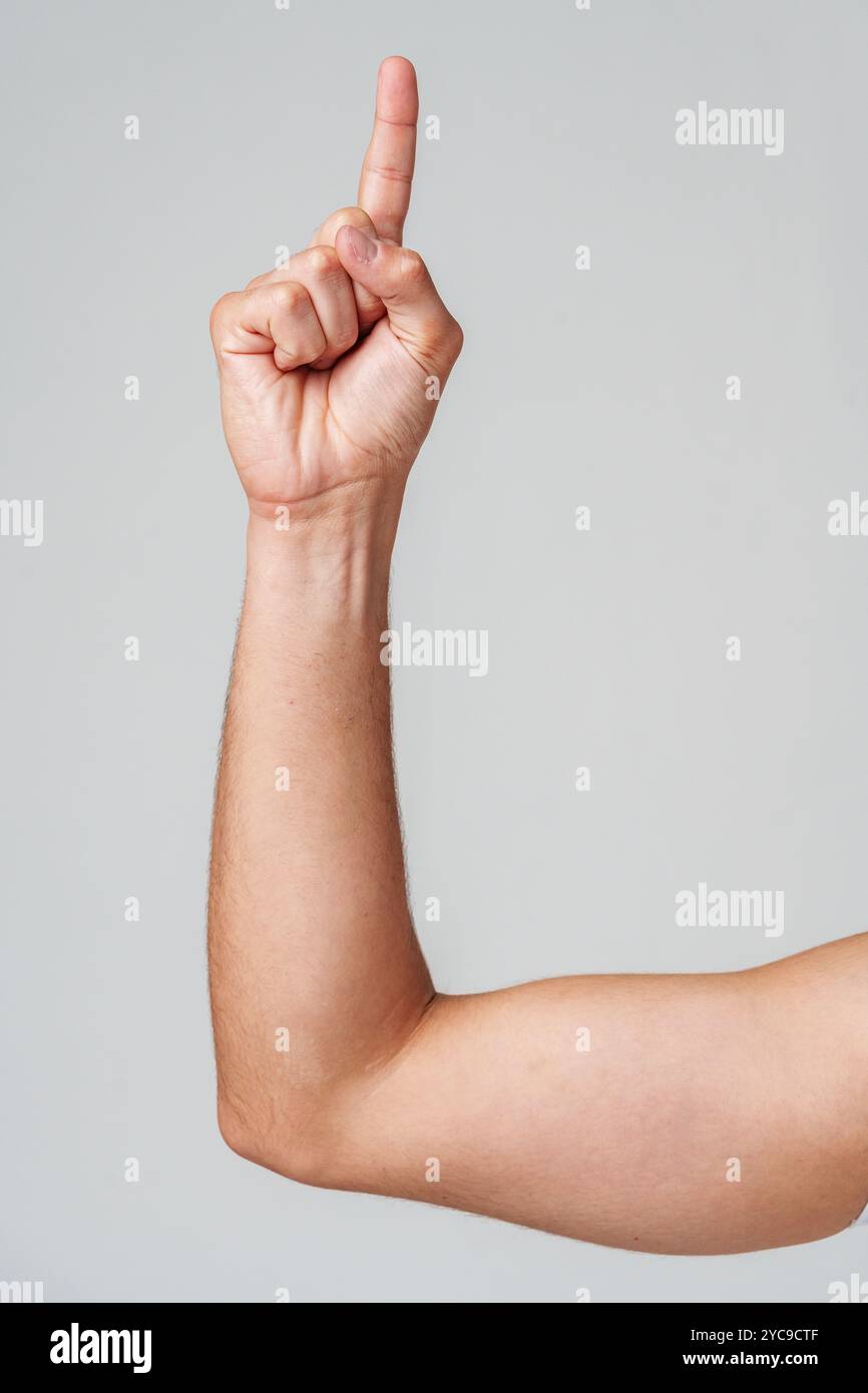 A person hand gesture against a neutral background Stock Photo - Alamy