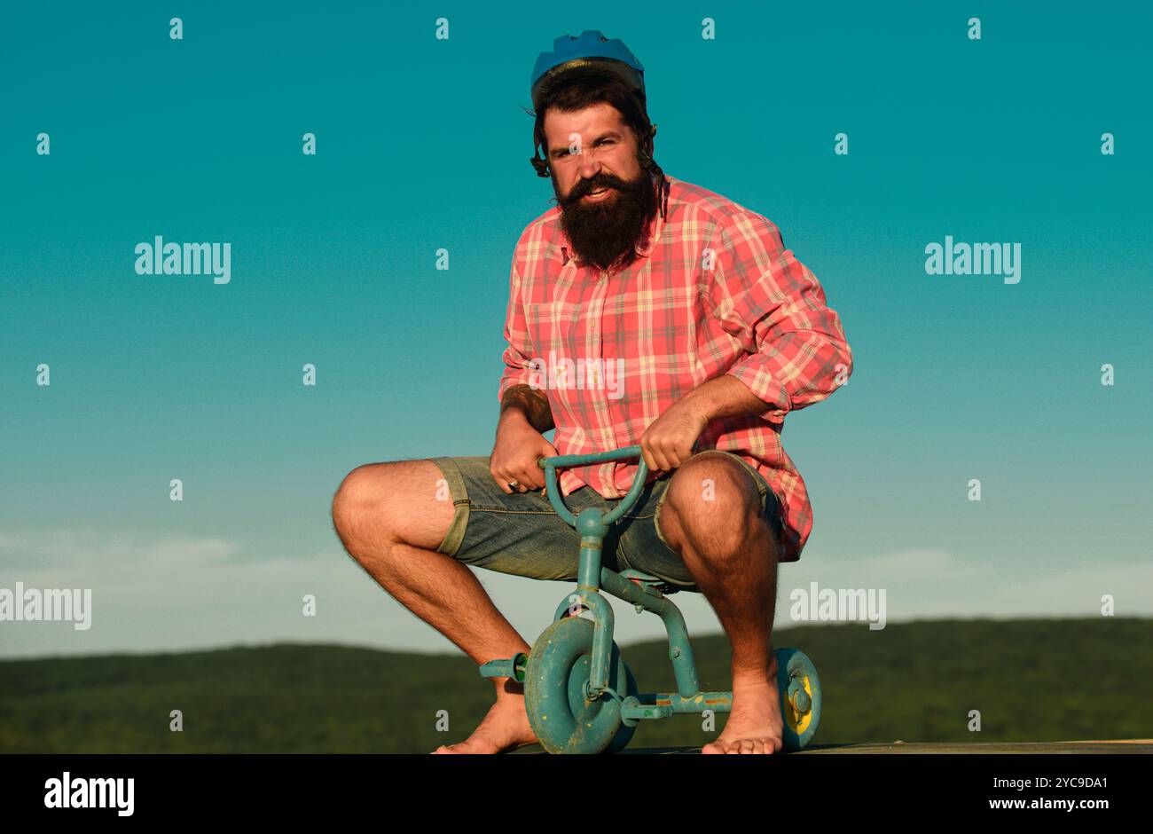 Crazy young man riding a small bike hi-res stock photography and images ...
