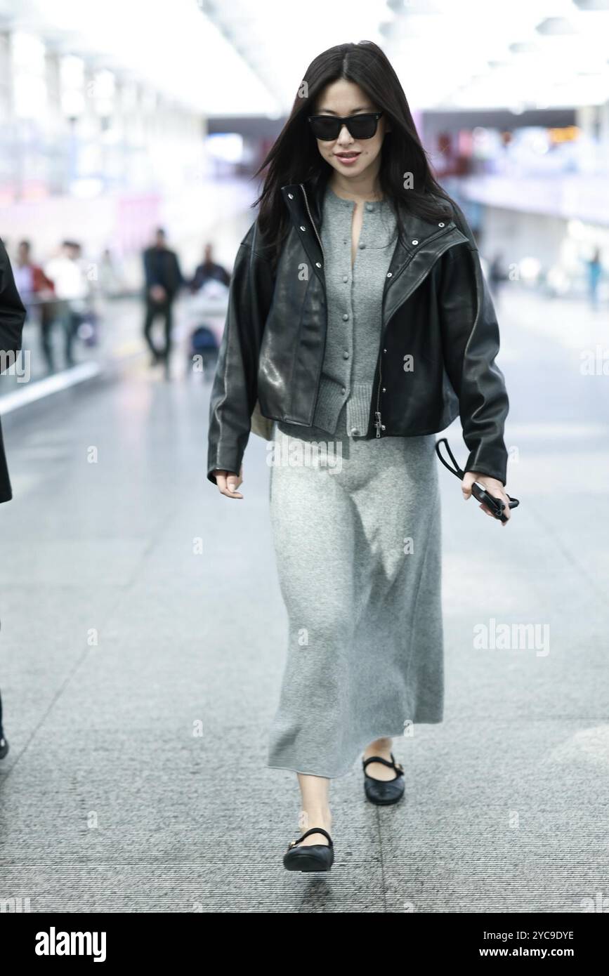 Chinese actress and singer Zhu Zhu appears at the airport in Beijing ...