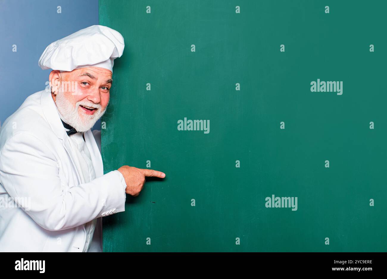 Senior chief cook. Portrait of chief cook with hand sign on blackboard ...