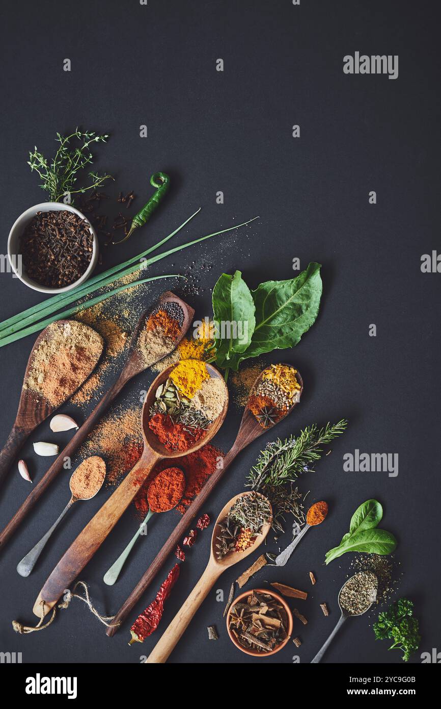 Kitchen, spices and curry on table for culinary ingredients, flavor and mockup space with leaves ...