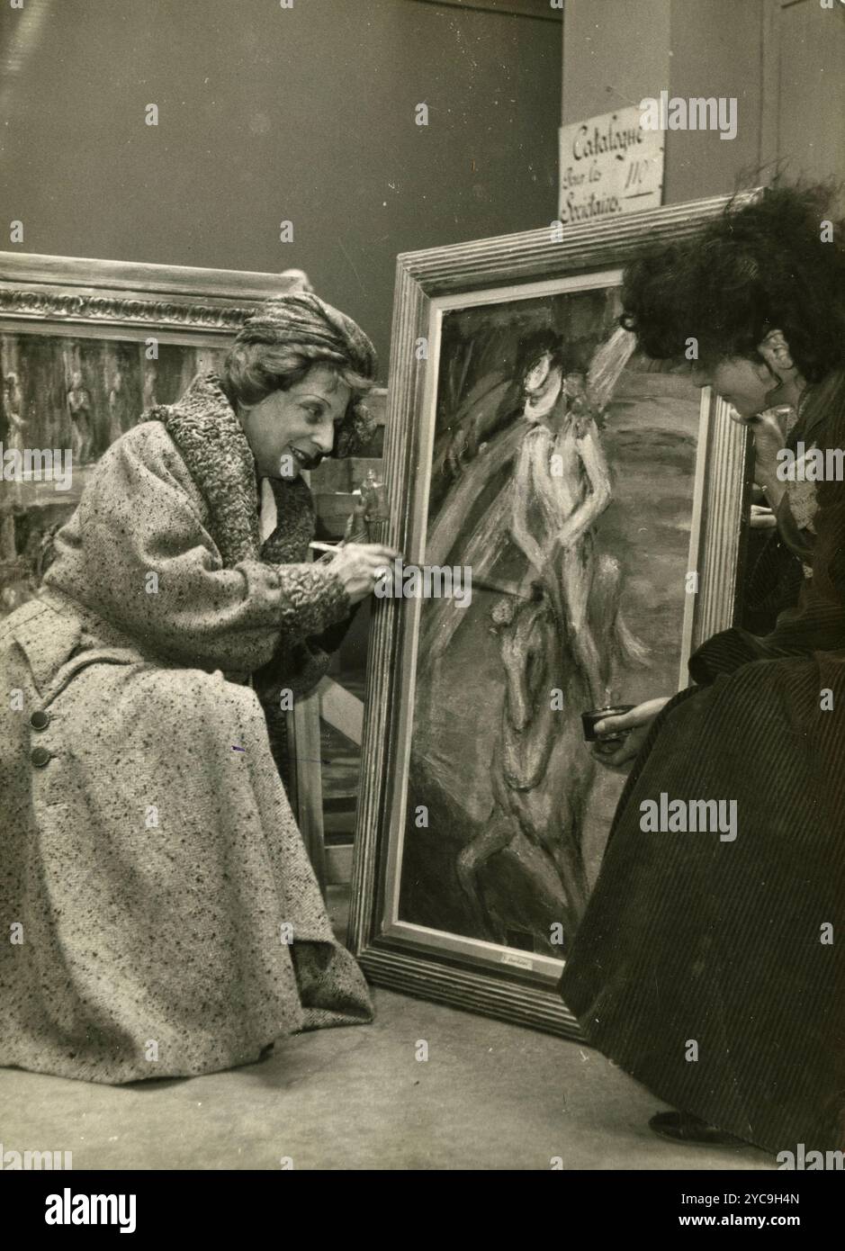 French artist Lou Albert-Lasard retouching his creation, France 1949 ...