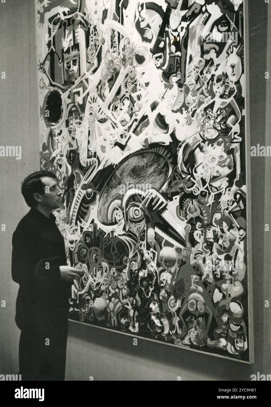 French artist Raymond Moretti with one of his paintings, 1965 Stock ...