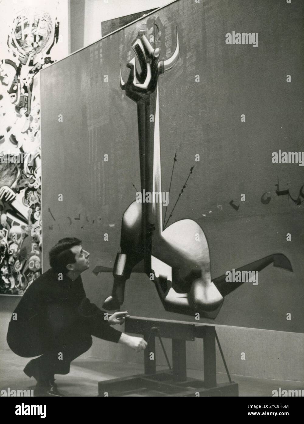 French artist Raymond Moretti with one of his paintings, 1965 Stock ...