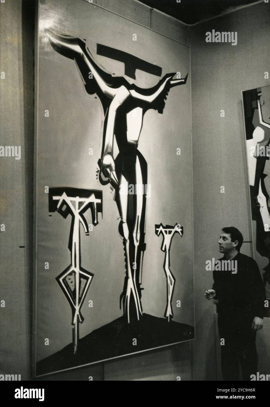French artist Raymond Moretti with one of his paintings, 1965 Stock ...