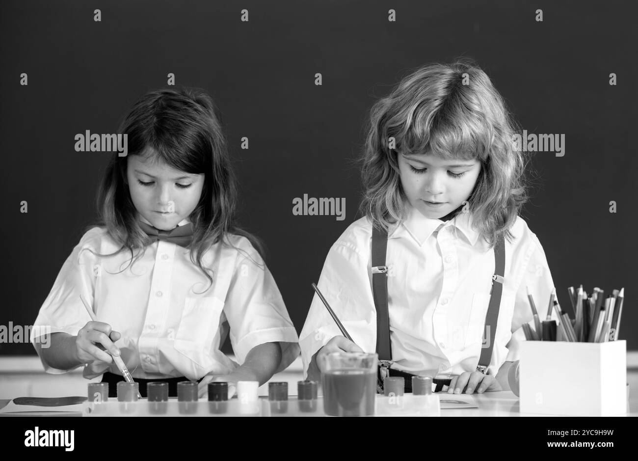 Kids pupils learning painting. Portrait school kids doing art homework ...