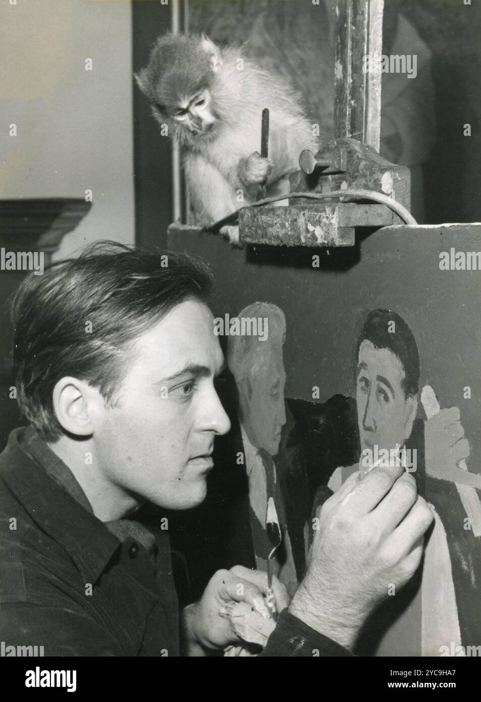 Artist John Lavrin and his monkey in his studio, 1958 Stock Photo - Alamy