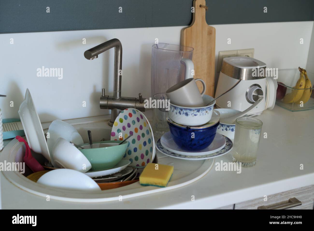 Time to clean: A daunting stack of soiled plates, bowls, and utensils ...