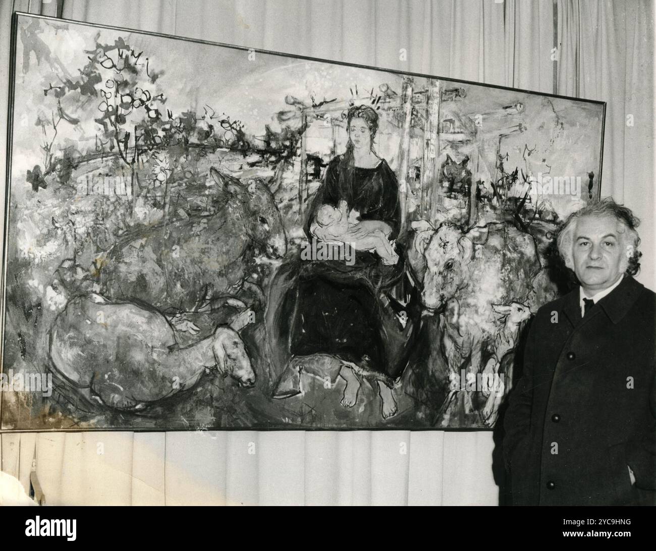 French artist Jean Commere with one of his paintings, 1975 Stock Photo ...