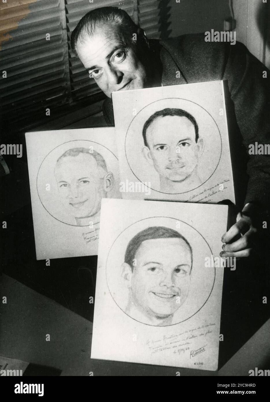 French artist Roger Curtis with the portraits of Aldrin, Collins, and ...