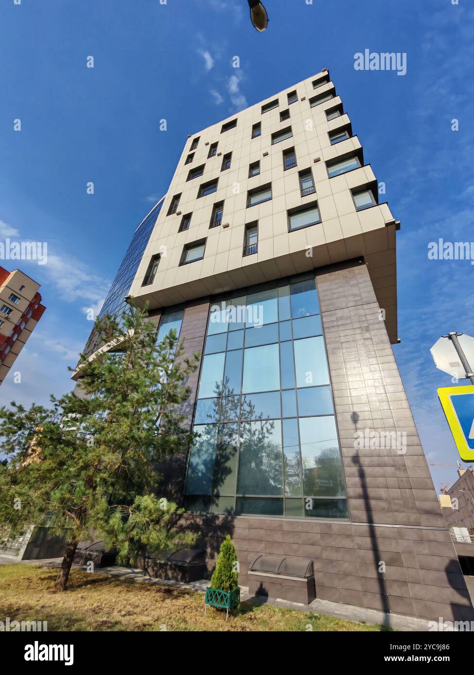 contemporary building with sharp angles, glass windows, and light ...