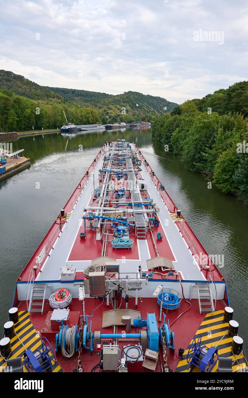 Pusher boat, towboat and its liquid cargo barge sailing up the River ...