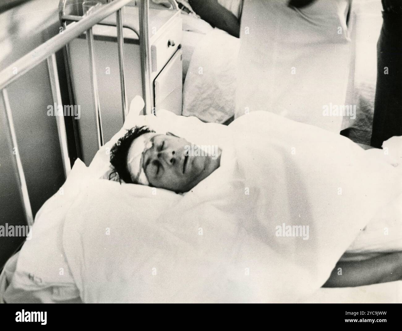 Man wounded at the head in an hospital bed, Italy 1970s Stock Photo - Alamy