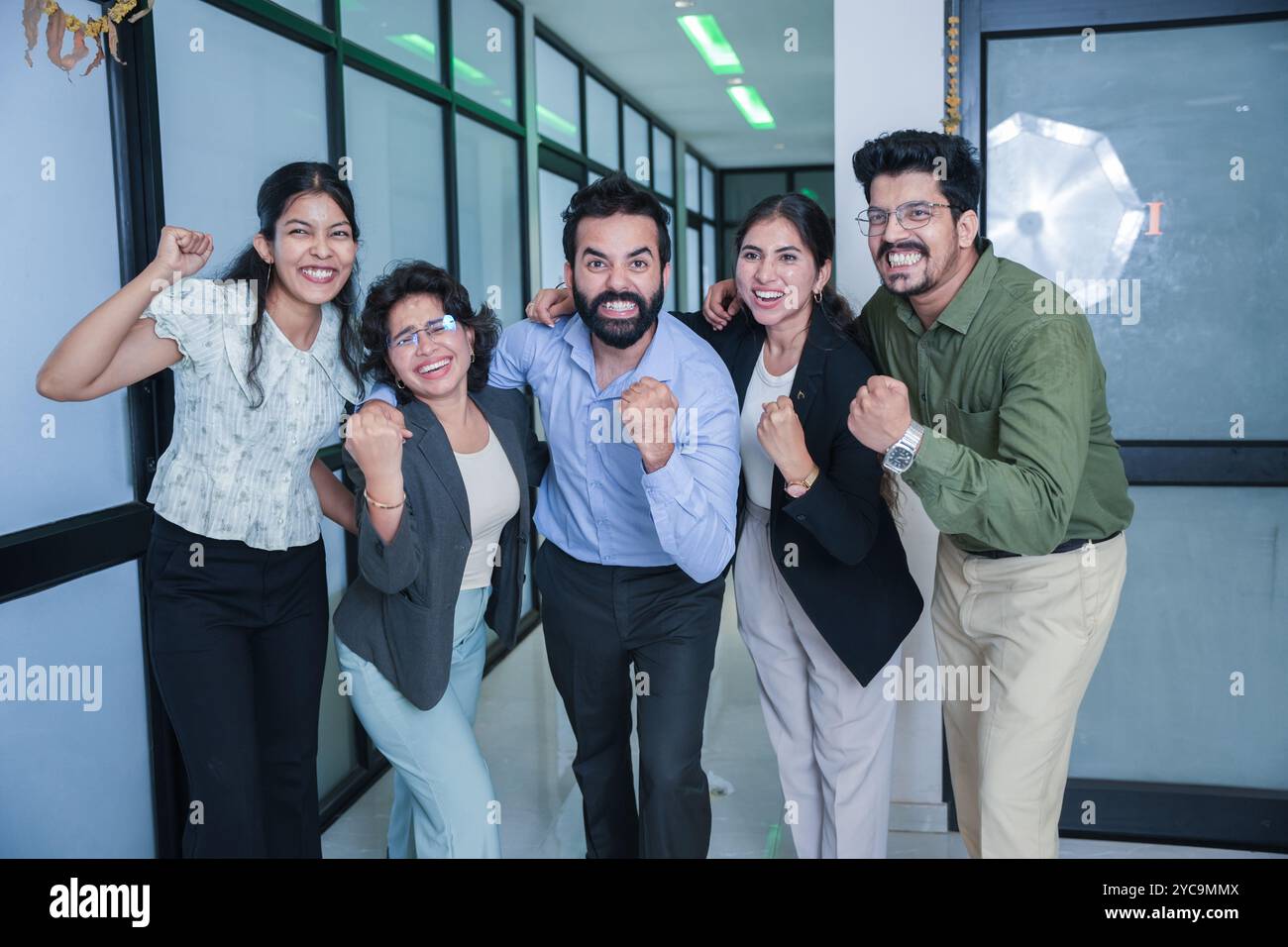 Happy Group of young indian office people in formal wear teaming up ...