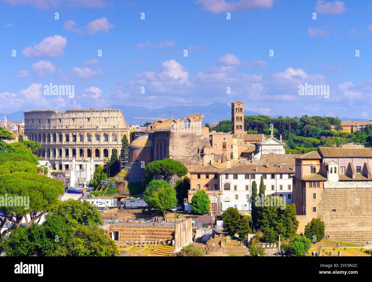 Italy, Rome: overview of buildings of the city and the Colosseum ...