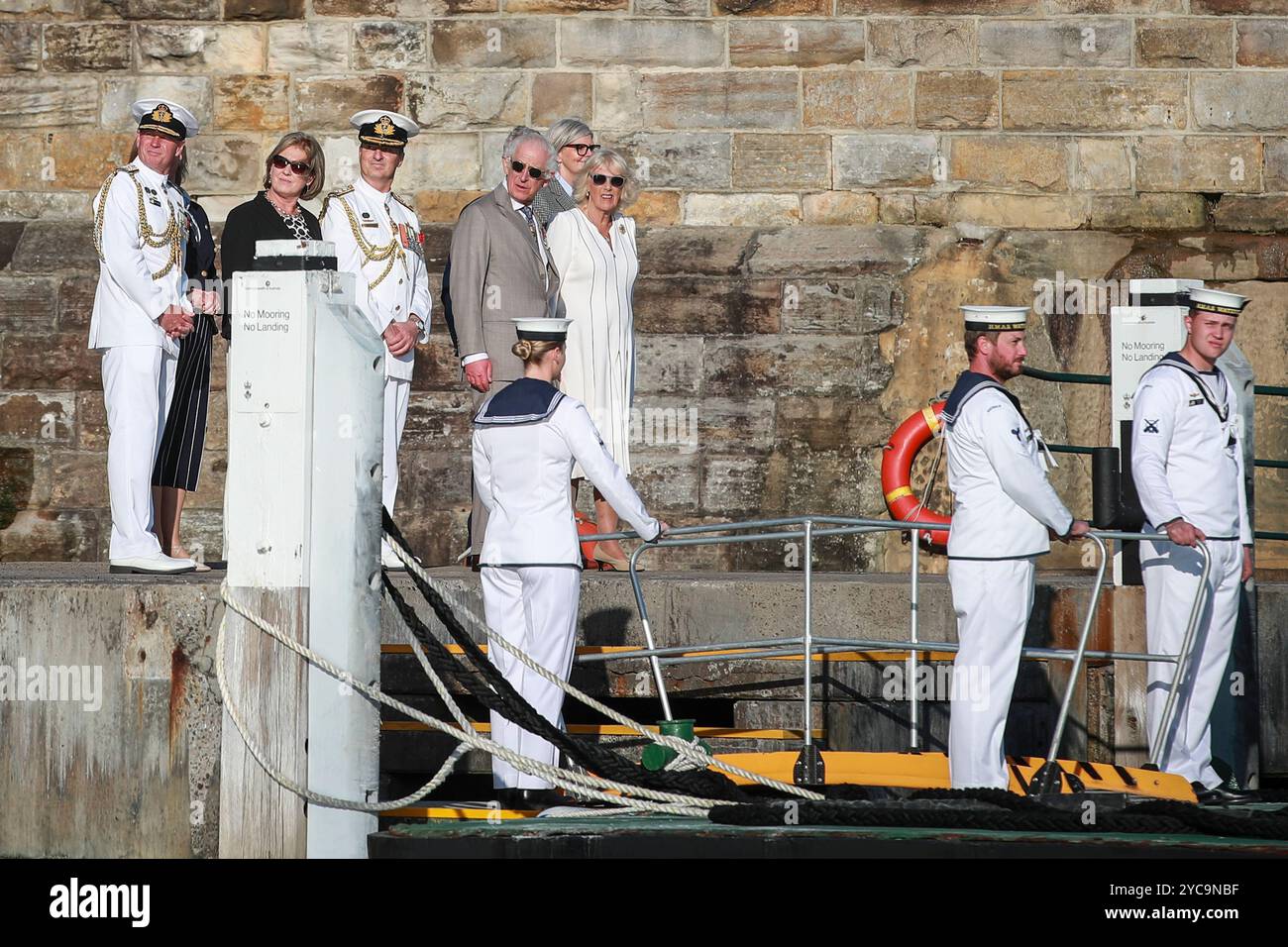Britain's King Charles III, center, and Queen Camilla, right, return to ...