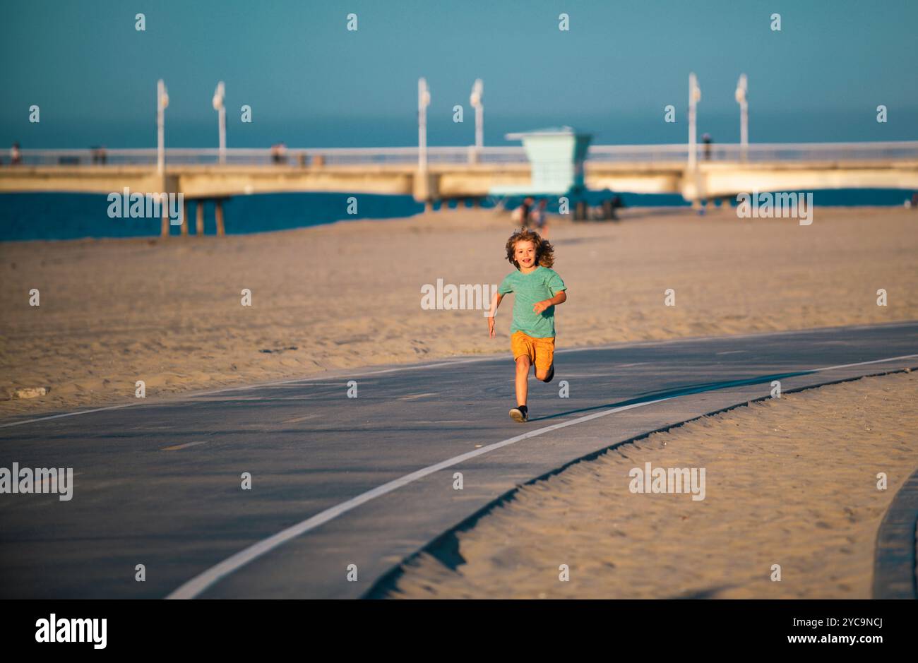 Cute boy running. Child boy run outdoor Stock Photo - Alamy