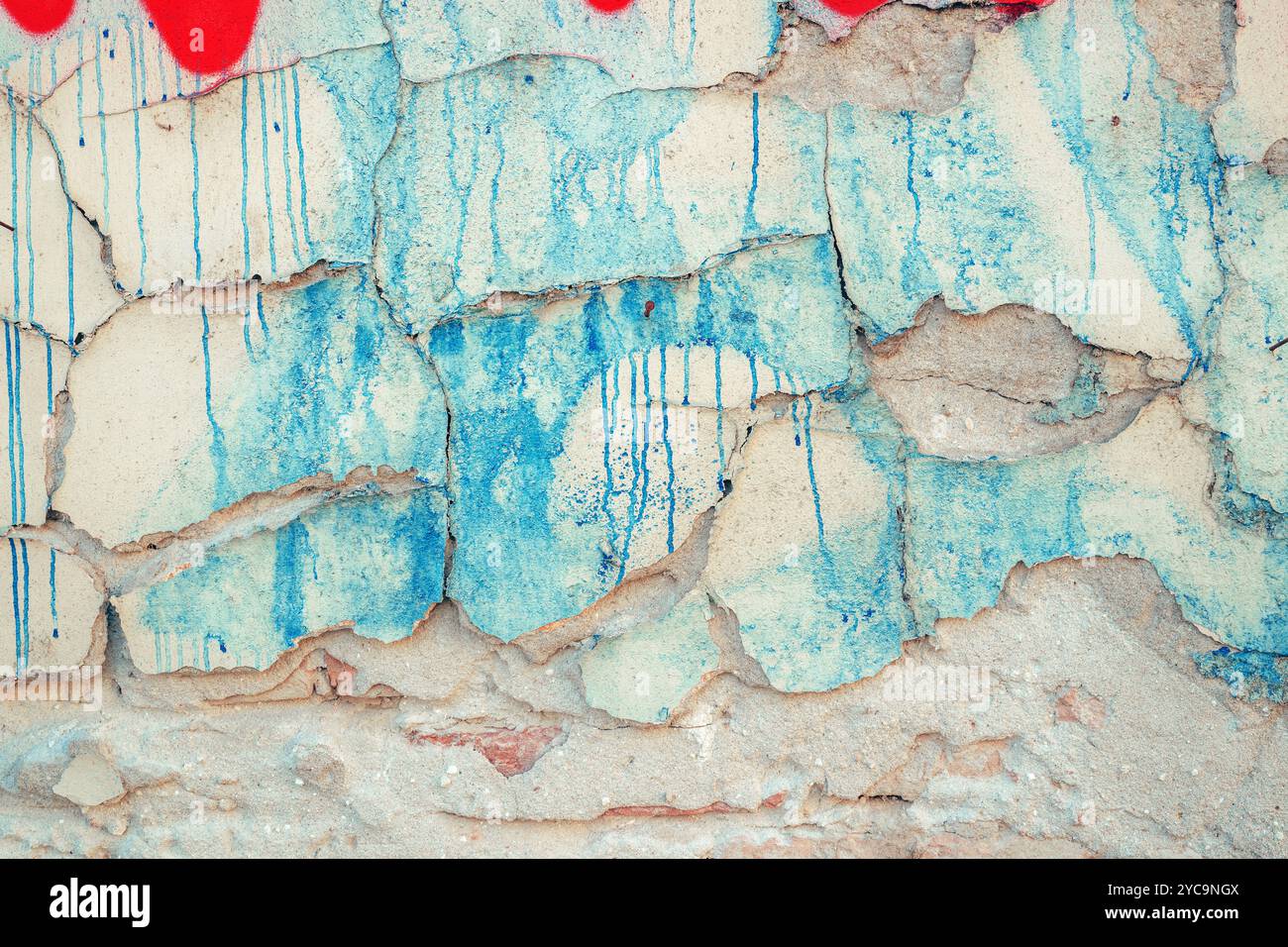 Paint spill pattern on worn wall surface as background and design ...